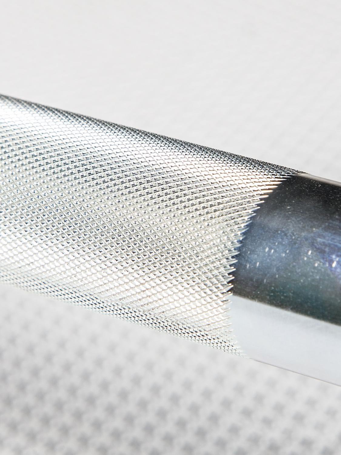 Olympic Bar Anatomy: Understanding Barbell Components for Lifting